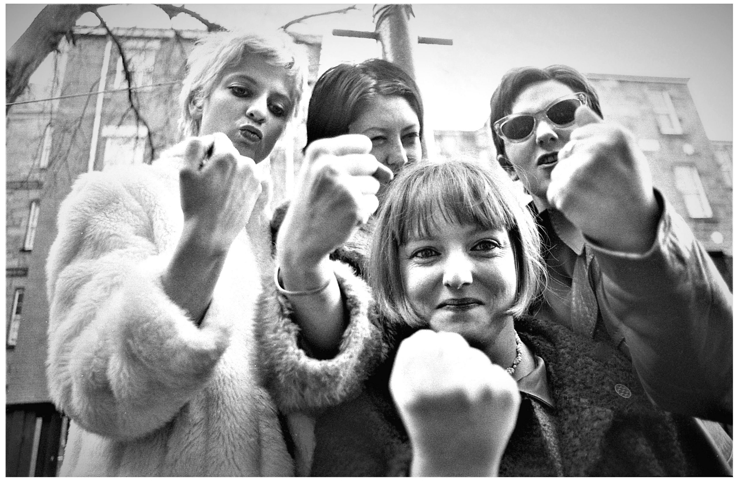 Picture of four women raising their fists.